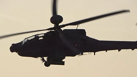 apache attack helicopter flypast backlit... | Stock Video | Pond5
