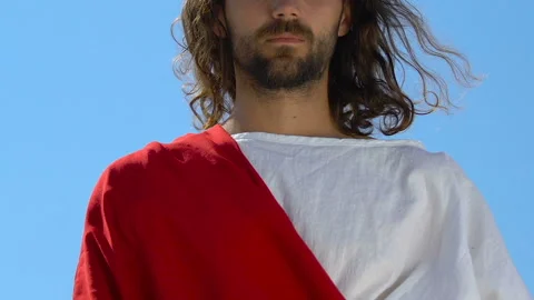 Apostle in white robe praying God agains... | Stock Video | Pond5