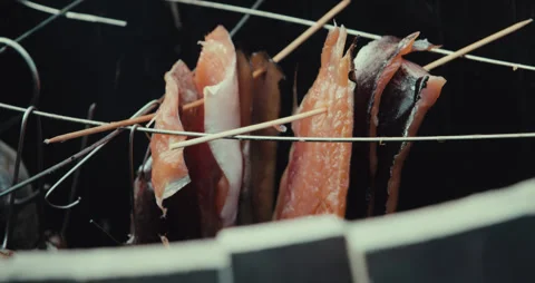 Appetising shot of fish hanging in a whi... | Stock Video | Pond5