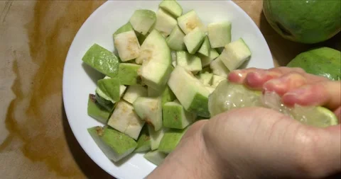 Apple guava being seasoned, top view | Stock Video | Pond5