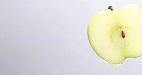 Apple juice dripping from fresh sliced g... | Stock Video | Pond5