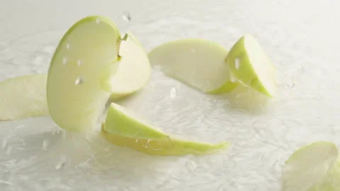 Apples and Slices Falling on White Backg... | Stock Video | Pond5