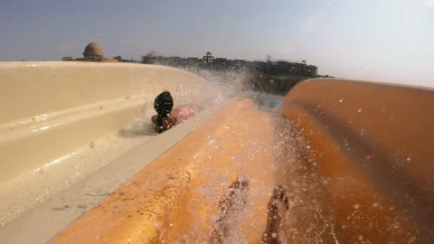 Aquapark. People slide down the water sl... | Stock Video | Pond5
