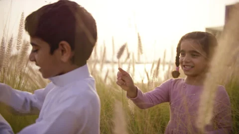 Arab children playing in the field. | Stock Video | Pond5