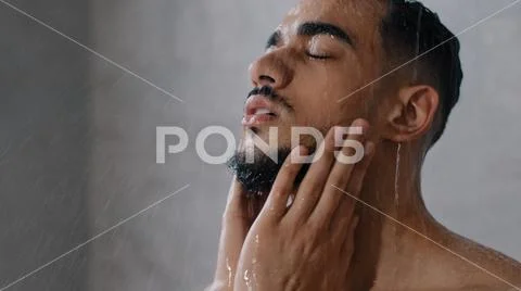 Arab indian man bearded guy naked male washes head with shampoo washing ...