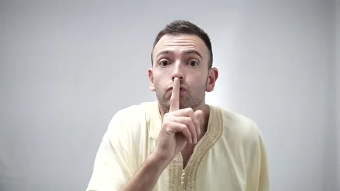 Arab man in Arabic djellaba puts finger ... | Stock Video | Pond5