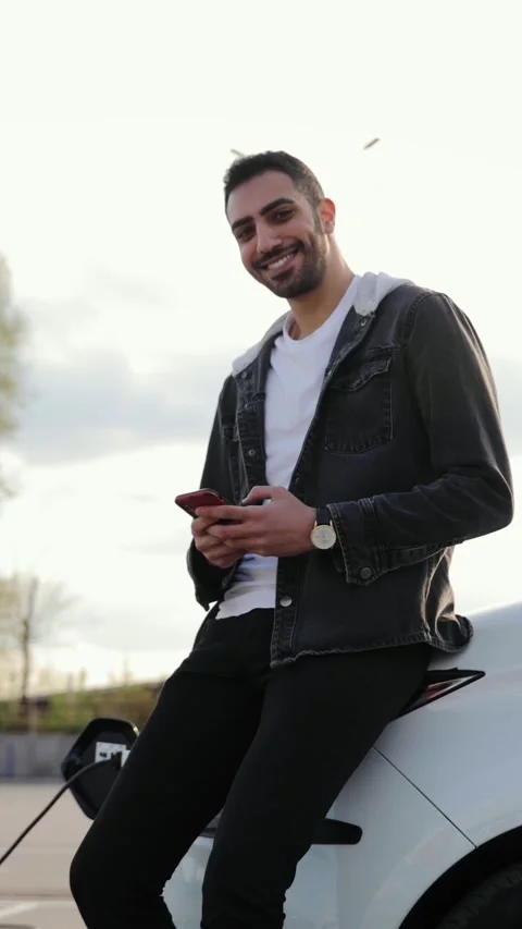 Arab man at electric charging station. Y... | Stock Video | Pond5