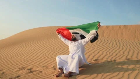 Arab man sitting with the UAE flag in th... | Stock Video | Pond5