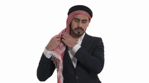 Arab man wearing and fitting traditional... | Stock Video | Pond5