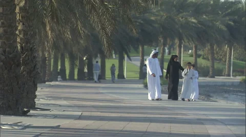 An Arabic family walks along a pathway a... | Stock Video | Pond5