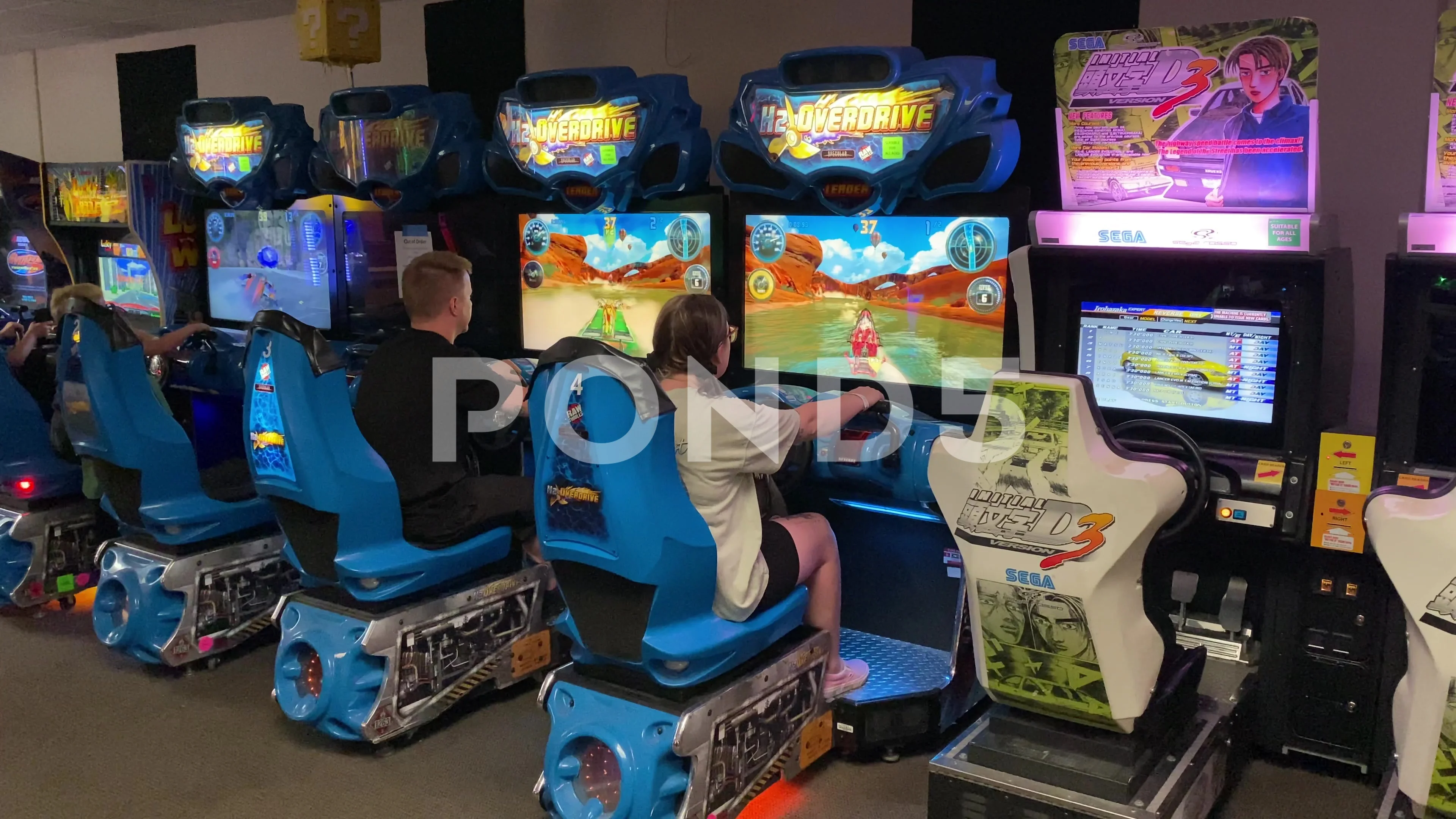 Man Playing Arcade Car Game