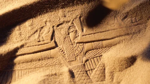 Archaeologist brushes sand from ancient ... | Stock Video | Pond5