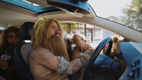 Archaic long-bearded caveman driving a m... | Stock Video | Pond5