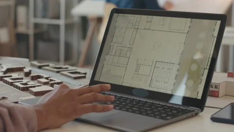 Architect Creating House Plan on Laptop | Stock Video | Pond5