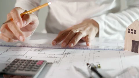 Architect drawing with ruler on house pl... | Stock Video | Pond5