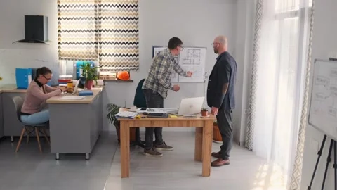 Architect explains floor plan to manager... | Stock Video | Pond5