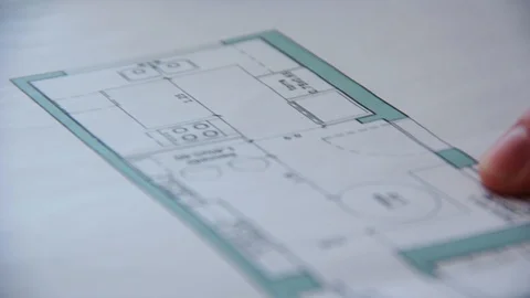Architect looking over the floor plans o... | Stock Video | Pond5