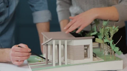 Architect showing his house plan to a cl... | Stock Video | Pond5