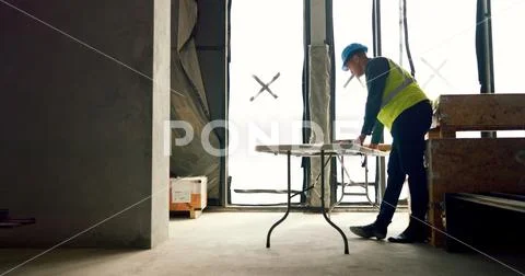 Photograph: Architecture, man, plan and construction site, architect ...