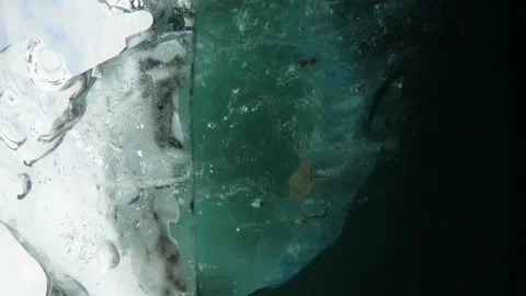 Arctic iceberg floats under water line m... | Stock Video | Pond5