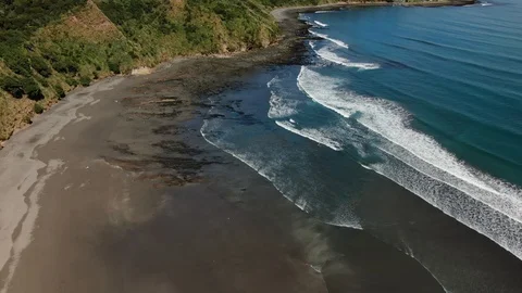 Areal footage revealing a coastal line i... | Stock Video | Pond5