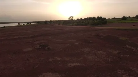 An arid African plain of red earth near ... | Stock Video | Pond5