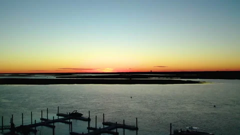 Ariel Over Water and Dock at Sunset 4K | Stock Video | Pond5