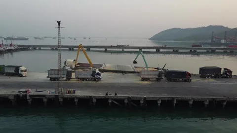 Ariel side pan of excavators off loading... | Stock Video | Pond5