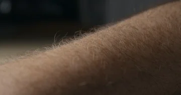 Arm hair rising slow motion | Stock Video | Pond5