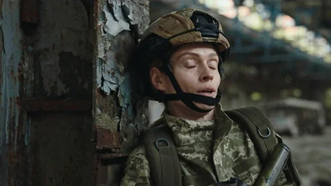 Armed female soldier with fear in face s... | Stock Video | Pond5