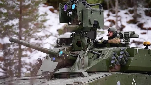 Armored vehicle with soldier in machine ... | Stock Video | Pond5