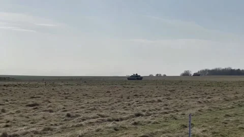 Army battle tank driving across an open ... | Stock Video | Pond5