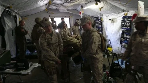 Army doctors in the field practice emerg... | Stock Video | Pond5