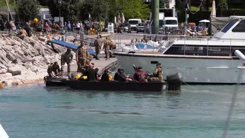 Army paratroopers approach pontoon in sp... | Stock Video | Pond5