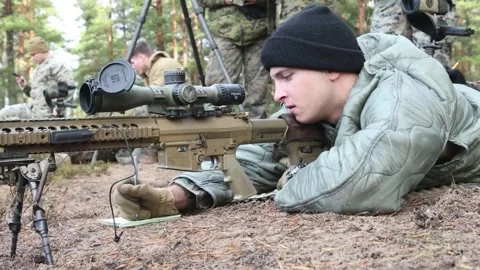 Army sniper writing in notebook at rifle... | Stock Video | Pond5