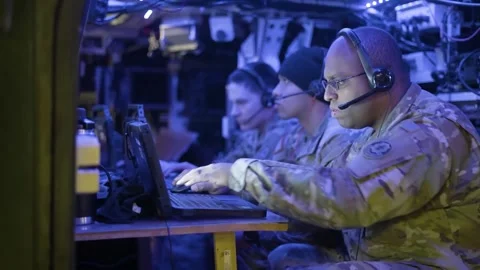 Army soldier working on computer inside ... | Stock Video | Pond5