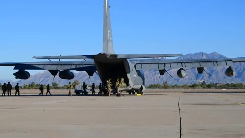 Army soldiers loading equipment onto C-1... | Stock Video | Pond5