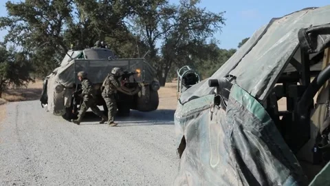 Army soldiers open fire near Stryker lig... | Stock Video | Pond5