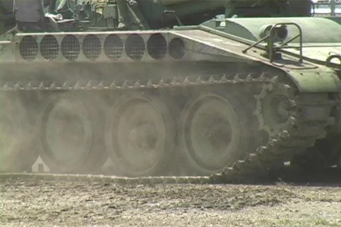 Army Tank rolling through Dust | Stock Video | Pond5