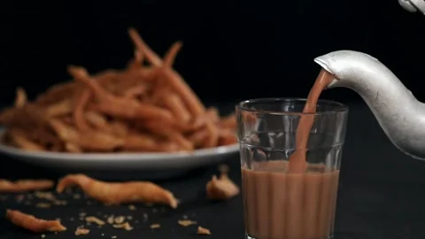 Aromatic Masala Chai pouring from a stai... | Stock Video | Pond5