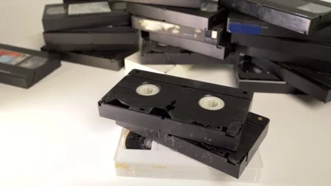 Arranging old worn-out VHS tapes in a st... | Stock Video | Pond5