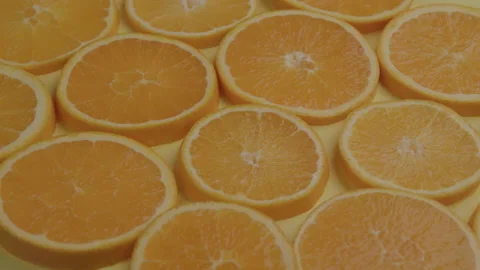 An Array of Orange Slices Against a Yell... | Stock Video | Pond5