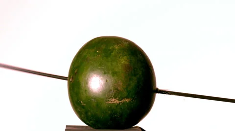 Arrow shooting through watermelon on whi... | Stock Video | Pond5