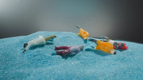Artificial figurines with bags falling o... | Stock Video | Pond5