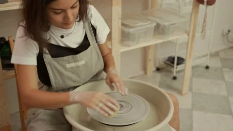Artisan cleaning pottery wheel in worksh... | Stock Video | Pond5