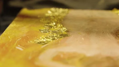 The artist applies gold to the oil paint... | Stock Video | Pond5
