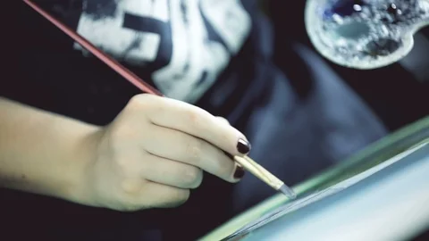 Artist hand with brush painting on canva... | Stock Video | Pond5