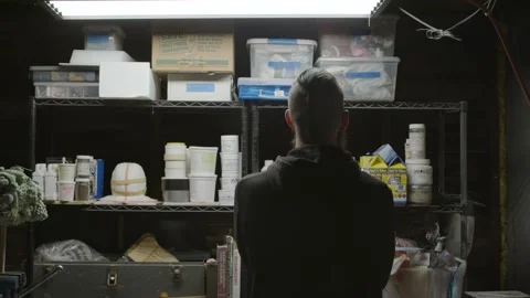 Artist Looking Up At Work Shelf | Stock Video | Pond5
