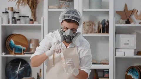 Artist mixing epoxy resin working in art... | Stock Video | Pond5