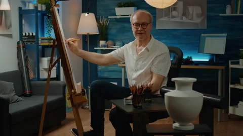 Artist in retirement age drawing authent... | Stock Video | Pond5